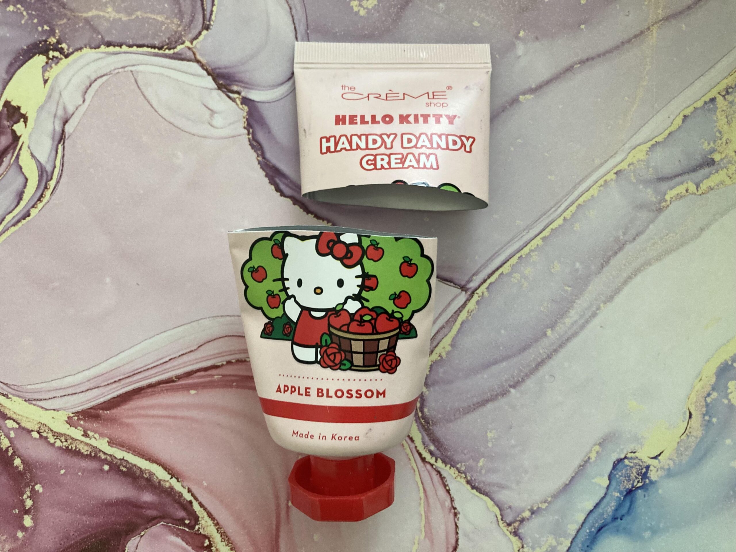 The Creme Shop Hello Kitty – Handy Dandy Cream in “Apple Blossom ...